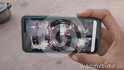 Close Up of Back View Man Rear View Using Shop Security Camera System ...