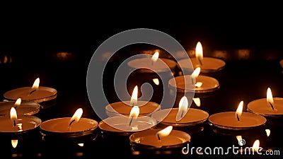 Close Up Burning Candles Floating on Water Surface in Dark. Scented ...