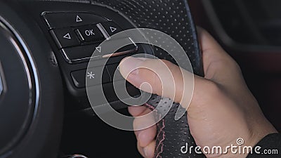 Close-up Hand of a Female Driver in a Suit Pressing Button To Enable or ...