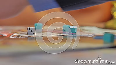 Close-up of the Hands of People Playing the Game Monopoly. Stock ...