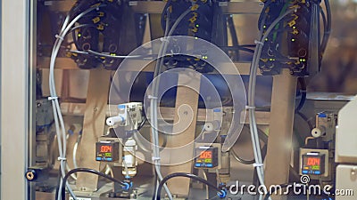 Close Up of an Industrial Machine Moving Back and Forth in a Modern ...