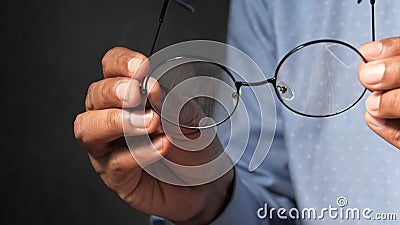 Close Up of Man Hand Holding Eyeglass in Dark. Stock Footage - Video of ...