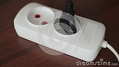 Close Up of Man Hand Putting Plug in Electricity Socket To Charge Stock ...