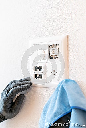 Close Up Of A Professional Cleaner Cleaning A Modern Light Switch And ...
