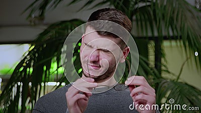 Close-up of a Sad Young Man with Glasses and Pimples on His Face ...