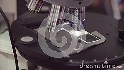 Slide Glass Under the Light Microscope Lens Stock Video - Video of ...