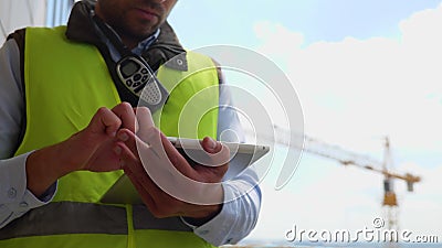 Close Up Shot of Male Engineer in Uniform Standing at Construction Site ...