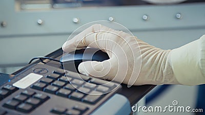 Close Up on a Worker Hand with Glove Working with a Computer Mouse ...