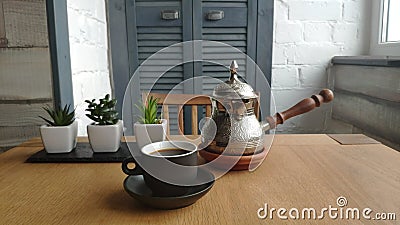 Closeup of a Coffee Pot with Coffee, a Cup of Coffee on the Table ...