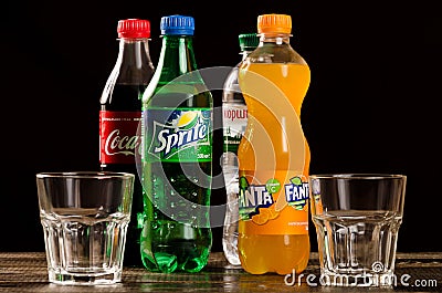 Coca Cola, Fanta, Sprite With Glasses On A Dark Background Editorial ...