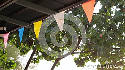 Colorful Triangle Flags Blowing in the Wind at a Beach Cafe. Flags of ...