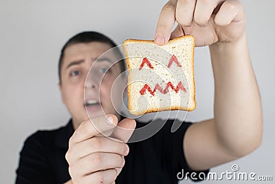 Conceptually About Gluten Intolerance. The Man Holds In His Hand A ...