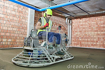 Concrete Flooring. Using Ride-on Power Trowelling Machine For Surface ...