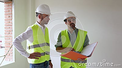 Construction Engineer Discussing with Architect Worker at Indoor ...