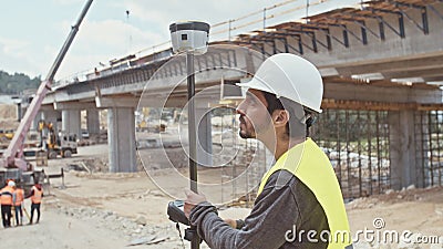 Construction Engineer Using a GPS Device for Measurements in a Large ...