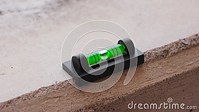 Construction Spirit Level Tool with Green Bubble on a Concrete Stock ...