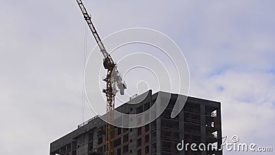 Construction Tower Crane Working on the Roof of Skyscraper. Stock Video ...