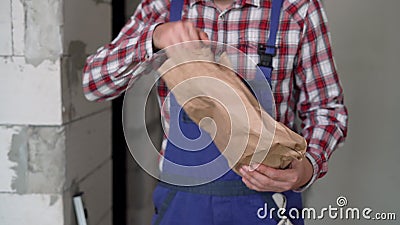 Construction Worker in Overalls Eating Burger Lunch at Workplace Stock ...