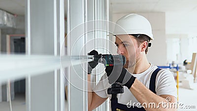 Construction Worker Screws the into the Drywall Rack Stock Footage ...