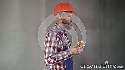 Construction Worker Wearing Uniform Eating Burger during Lunch Break ...