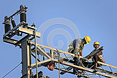 Construction Workers Fixing Overhead Electrical Cables Of Pune Metro ...