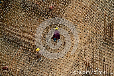 Construction Workers In India Standing On A Rebar Reinforcing Bar ...
