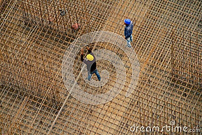 Construction Workers In India Standing On A Rebar Reinforcing Bar ...