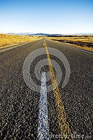 Continuous Road In A Scenic With Mountain Ranges Afar Stock Image ...