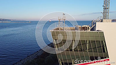 Control Tower of Ships with Big Cargo Ship Entering the Port at the ...