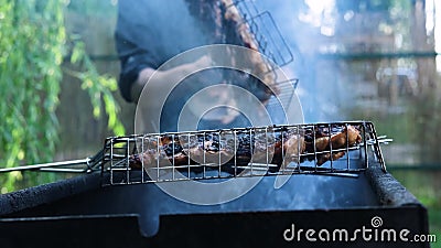The Cook Flips the Chicken Meat on the Grate Above the Grill for Even ...