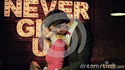 Couple Sitting on the Sofa in Arms and Caressing Each Other. Slow ...