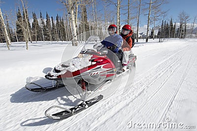 Couple On Snowmobile Royalty Free Stock Photo - Image: 30843915