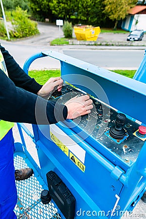 Crane Driver Driving Hydraulic Lifting Ramp With Control Desk Royalty ...