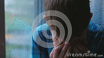 Crying Boy Looks Out The Window In The Rain. Stock Video - Video of ...
