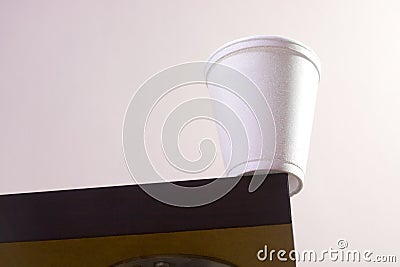 Cup On Table Edge Stock Photography - Image: 1340122