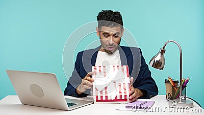 Curious Office Worker in Elegant Suit Sitting at Workplace, Unboxing ...