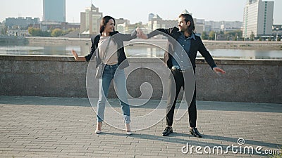 Dance Loop of Cheerful Young Couple Holding Hands and Making Wave ...