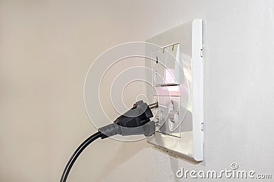 The Dangers Of Using Electricity In The Home Include A Black Plug That ...