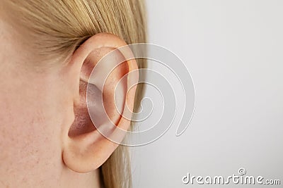 Darwin`s Tubercle On The Ear. The Girl At The Reception At The Plastic ...