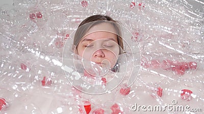 Dehydrated Sick Woman is Lying in a Pile of Plastic Bottles ...