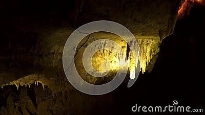 Dimly Lit Cave and Stalactite Hanging from the Cave Ceiling Stock ...