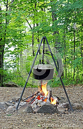 Dinner Cooks Over A Open Fire Royalty Free Stock Images - Image: 21049389