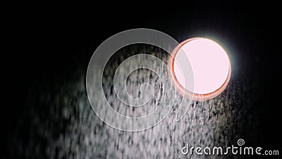 A Directional Beam of Light and a Thin Rain in Front of Him. on a Black ...