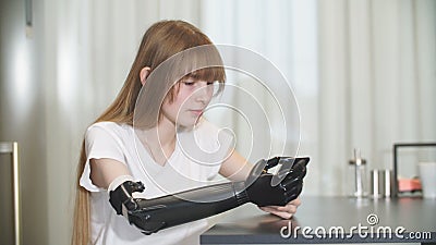 Disabled Girl Checking Her Metal Prosthetic Arm. Stock Footage - Video ...