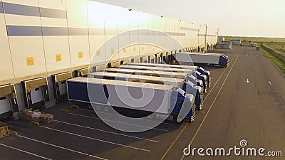 Distribution Warehouse with Trucks Awaiting Loading Stock Video - Video ...