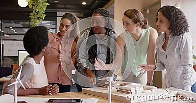 Diverse Team of Happy Female Architects Discussing Architectural Model ...