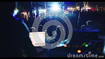 DJ Playing in a Large Trance Party with Large Crowd of People Dancing ...