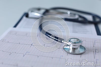 Docter Workplace With A Stethoscope Cardiogram Chart With Medical Table ...