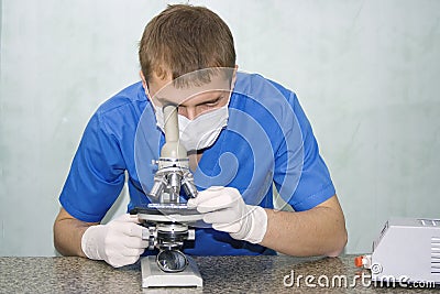 Senior Female Doctor Looking in Microscope at Lab Stock Photo - Image ...