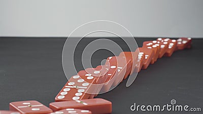 Domino Effect - a Series of Red Dominoes Falling Down the Chain Stock ...